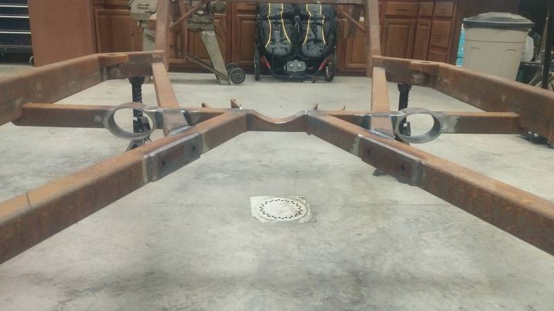 Routing exhaust through frame cross members?