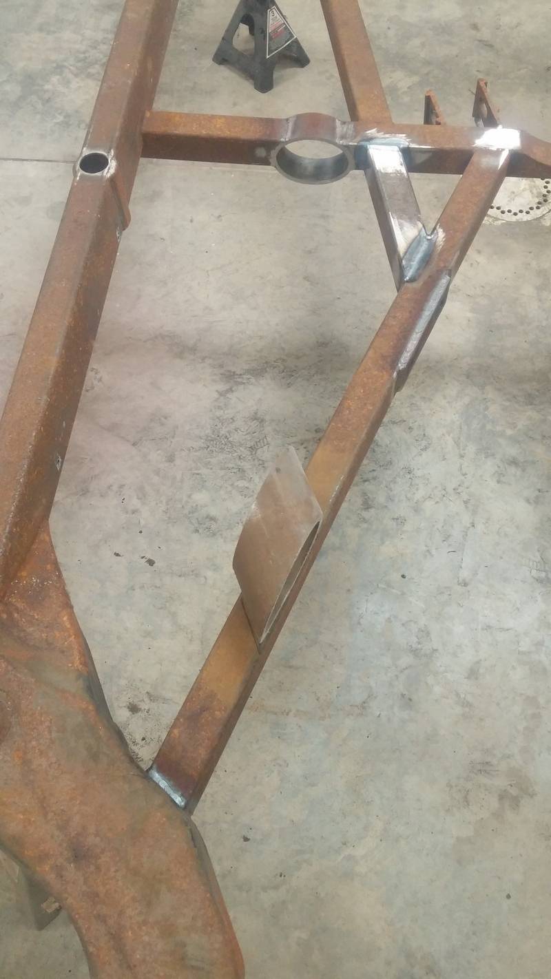 Routing exhaust through frame cross members?