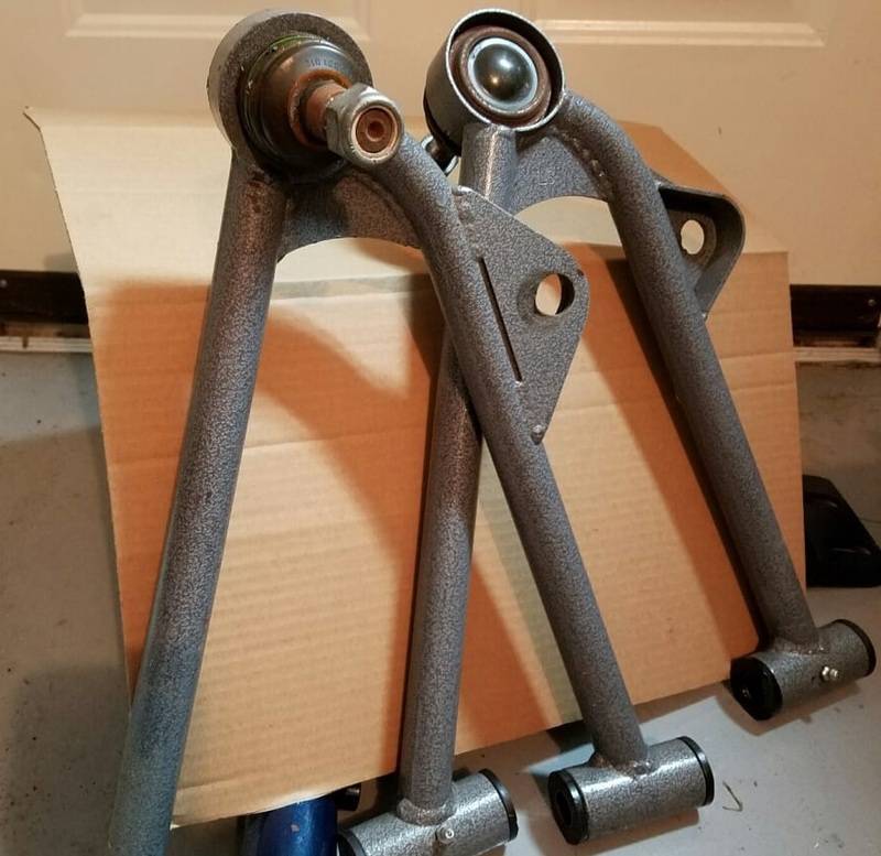 Powder coating lower control arms with ball joints
